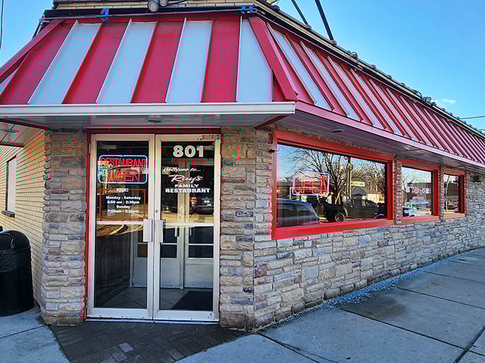 Ray's red-striped awning and stone exterior scream "classic American diner." Comfort food headquarters since before comfort was cool.