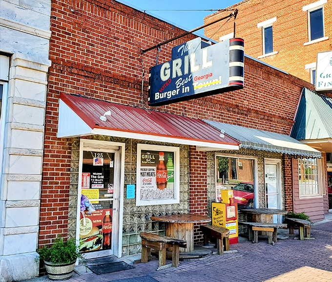 The Grill's nostalgic storefront and wooden benches whisper of simpler times when burgers were honest and calories didn't count.