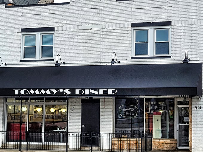 Tommy's Diner: Classic black awning, white brick, and that unmistakable diner glow &ndash; Tommy's looks like it was plucked straight from an Edward Hopper painting.