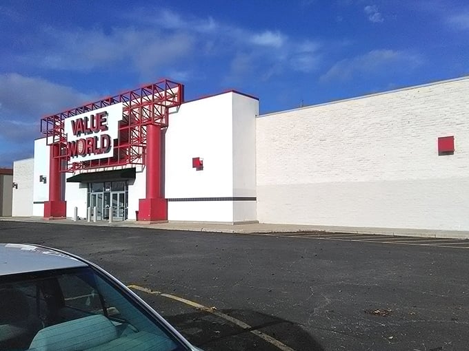 Value World's dramatic red entrance frame isn't just architecture &ndash; it's a portal to the parallel universe of amazing deals.