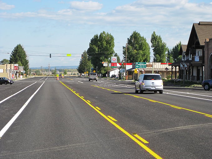 Victor's charming main drag offers small-town authenticity with the mighty Tetons standing guard like nature's own security detail.
