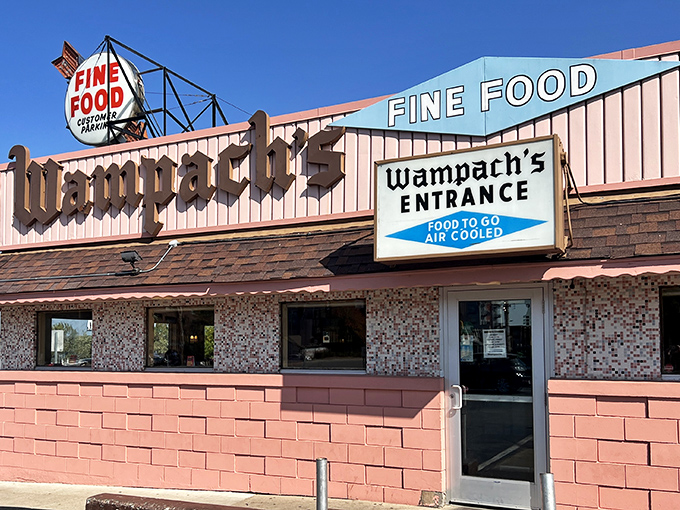 Wampach's pink palace of breakfast - where "Fine Food" isn't just a sign, it's a solemn promise kept since your grandparents' first date.