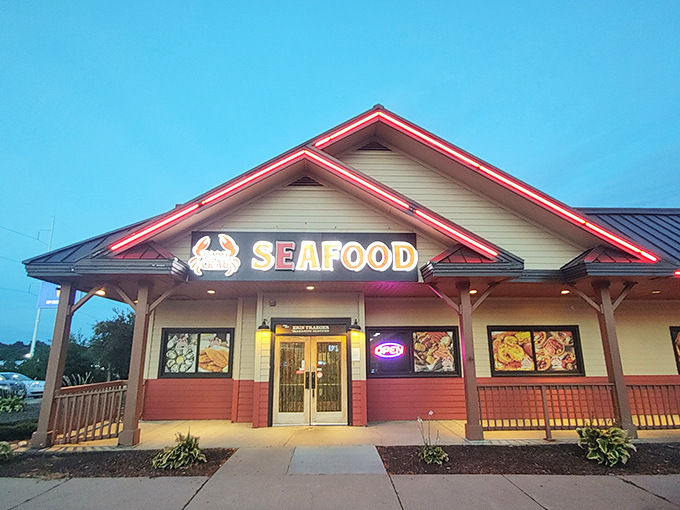 Yummy Crab's neon-lit entrance glows like a lighthouse for the seafood-starved, beckoning with promises of butter-drenched delights.