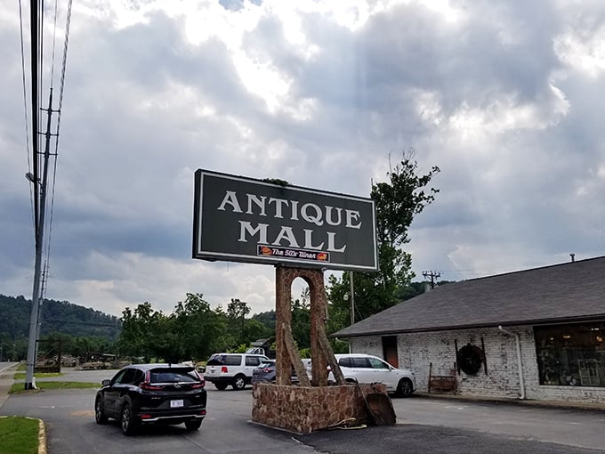 The "Antique Mall" sign might as well read "Warning: Your wallet is about to get lighter and your home more interesting."