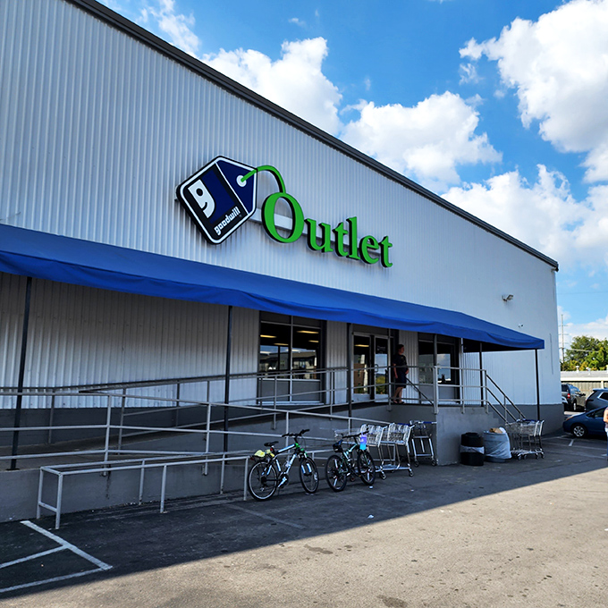 The blue Goodwill Outlet sign &ndash; where bargain hunters gather like prospectors during the gold rush.