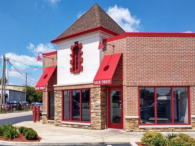 The red trim and stone facade scream "donut royalty"&mdash;a bakery that's earned its crown one perfect glazed ring at a time.