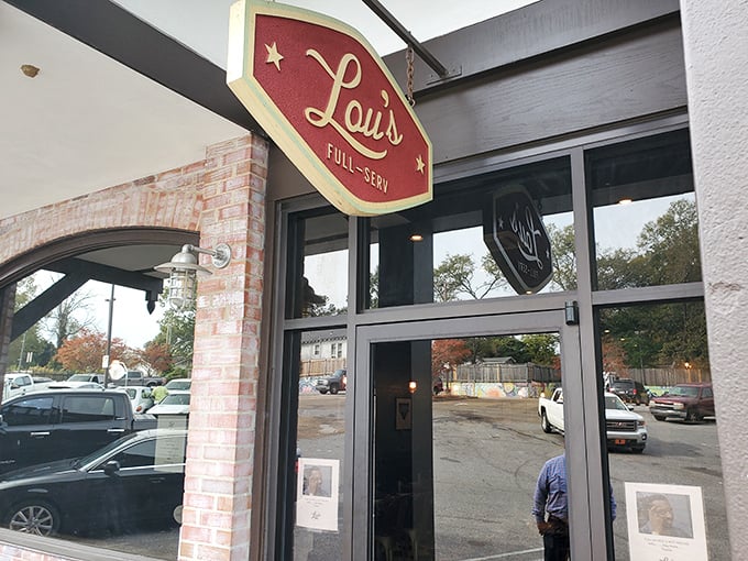 The warm glow of Lou's welcomes hungry patrons like a lighthouse guiding ships to the harbor of deliciousness.