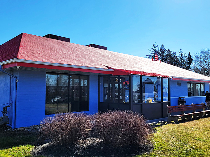 Morning sunshine hitting the Marsh Road Diner's vibrant exterior &ndash; like a patriotic postcard for pancake enthusiasts.