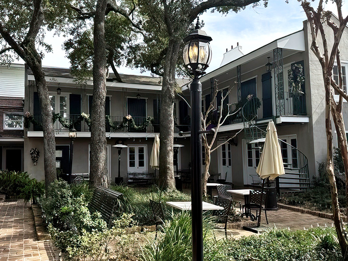 The courtyard at Mary Mahoney's - where ancient oaks provide shade for conversations as rich as their gumbo. 