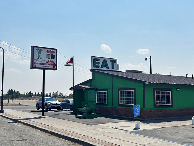 Under that bright Idaho sky, Pickle's Place stands like a vibrant green beacon of sandwich hope for hungry travelers.