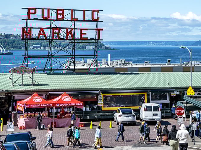 That iconic Pike Place sign overlooking Elliott Bay – a reminder that your dinner probably had a better view than your apartment.