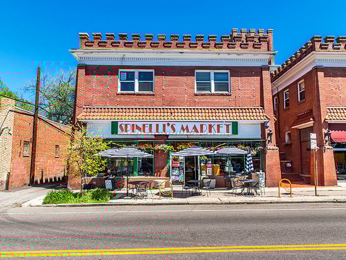 Blue skies frame Spinelli's charming storefront, where outdoor tables whisper, "Stay awhile and enjoy that sandwich properly."