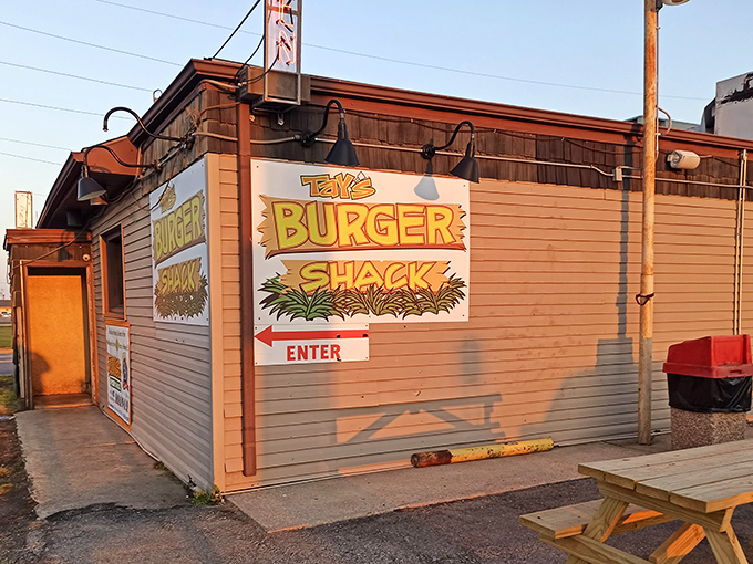 Sunlight casts a golden glow on Tay's &ndash; a modest burger temple where simplicity and flavor create a religious experience.
