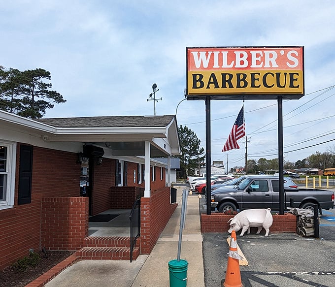 That iconic sign and American flag combo? It's the barbecue equivalent of a welcome mat that says "Get ready for greatness."
