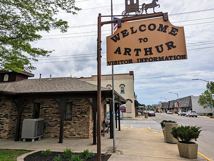 Horse-drawn buggies aren't just for show here&mdash;the Welcome to Arthur sign perfectly captures the town's unique cultural crossroads.