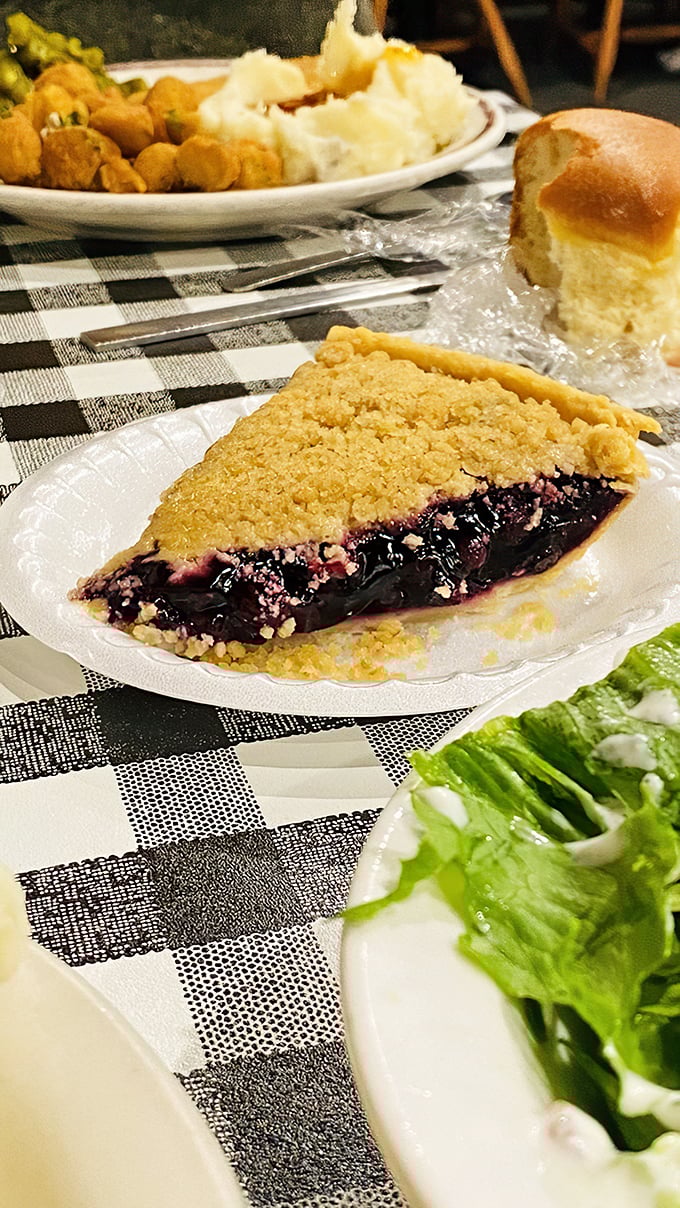 This blueberry pie isn't just dessert; it's a deep dive into summer memories where the filling-to-crust ratio achieves mathematical perfection.