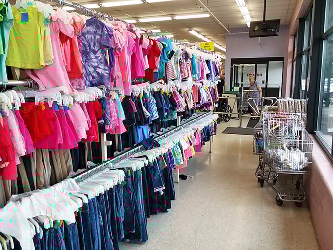 A rainbow of possibilities hangs in perfect formation &ndash; childhood dreams and adult wardrobes colliding in a kaleidoscope of fabric.