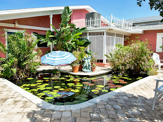 Not just any koi pond&mdash;this is Florida's version of zen, where tropical plants and lily pads create a courtyard oasis that whispers "slow down" to hurried souls.