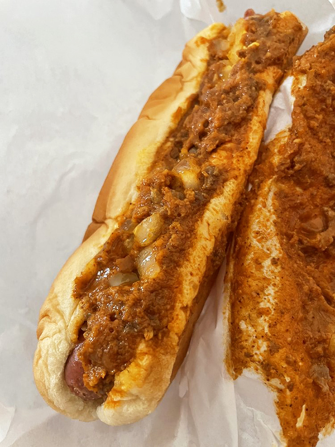 Behold the star of the show! Cupid's signature chili dog with that perfect meat-to-bun ratio makes diet plans vanish in a single bite.