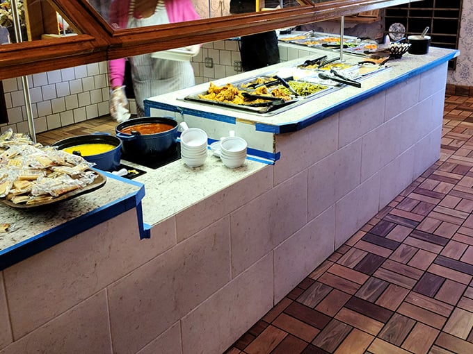 The buffet line&mdash;where dreams are made and diets go to die. Each metal tray holds a different homestyle masterpiece waiting to be discovered.