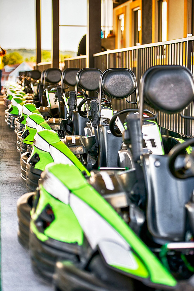 A lineup of mean, green racing machines awaiting their next speed demons. Like soldiers at attention, these karts stand ready for battle.