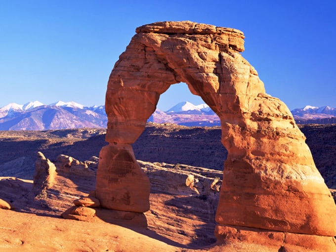 Delicate Arch stands like nature's perfect sculpture—sixty-five feet of sandstone defiance against gravity and time. Utah's unofficial mascot.