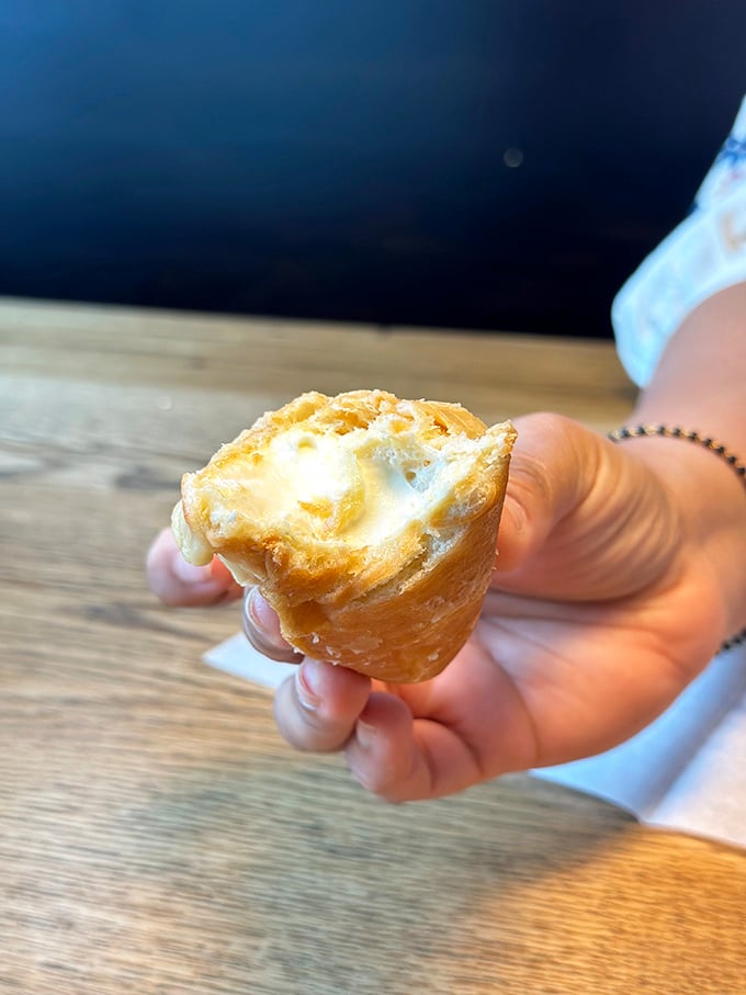 This cream-filled pastry isn't just a donut&mdash;it's edible evidence that simplicity and perfection often go hand in hand. Worth every delicious calorie!