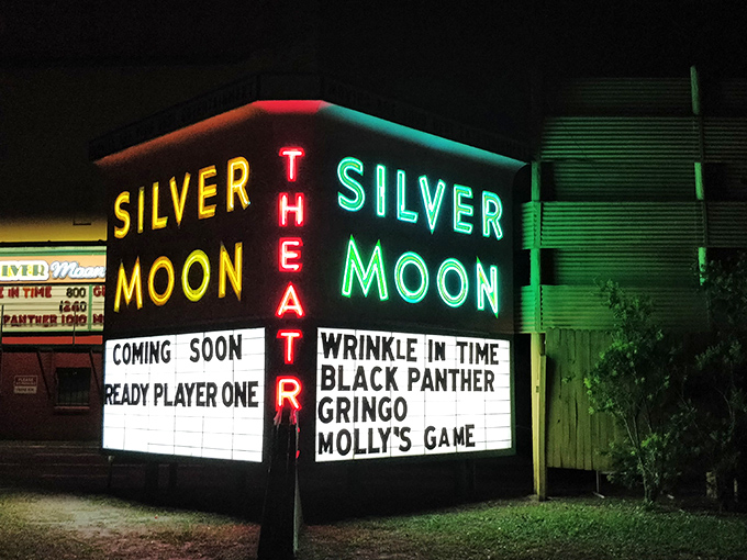 The neon glow of the Silver Moon marquee cuts through the night like a beacon from another era, promising double features and memories to last a lifetime.