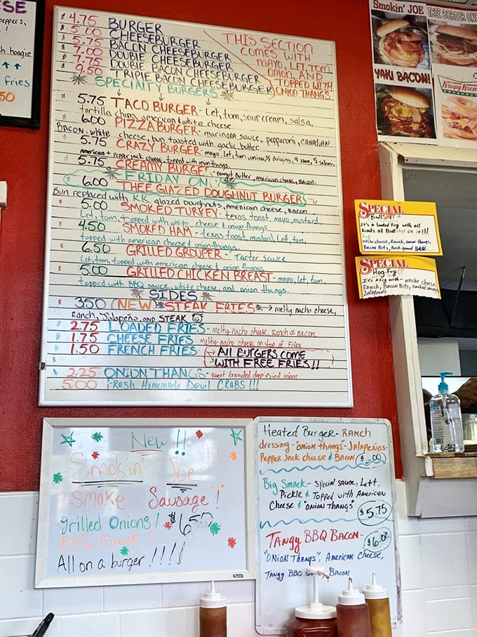 Handwritten menu board showcases creations from the simple Burger ($4.75) to the audacious Thee Glazed Donut Burger. Burger poetry in multicolor markers.