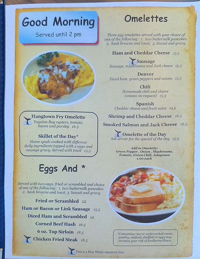 The menu reads like a love letter to breakfast classics, with those little whale tail symbols marking dishes worth diving into. 