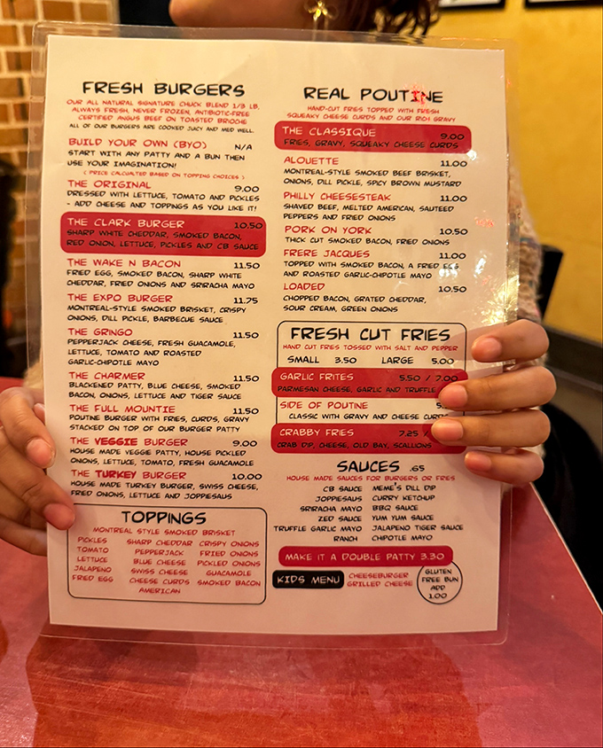 This menu isn't just a list&mdash;it's a roadmap to happiness. The Clark Burger, Wake N Bacon, and authentic poutine options make decision-making deliciously difficult.