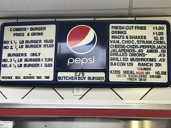 A menu board that gets straight to the point&mdash;no fancy names or gimmicks, just honest burgers categorized by weight. Life should always be this straightforward.