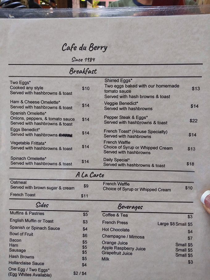 A menu that reads like a love letter to breakfast classics. Notice how everything comes with hashbrowns? That's not an accident, folks.