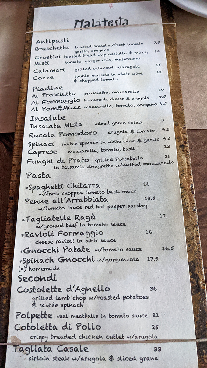 A handwritten menu&mdash;the universal sign of "we make everything fresh today." No QR codes or fancy fonts, just honest Italian cooking.