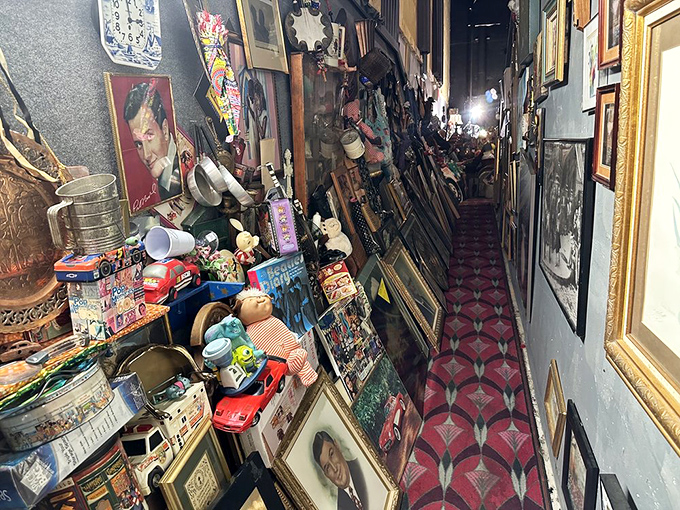 This narrow corridor lined with frames and collectibles feels like walking through someone's memories, each item with its own story to tell.