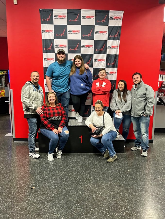 Victory tastes sweeter when shared. These racers celebrate their triumphs at the winner's podium, already planning their next lap.