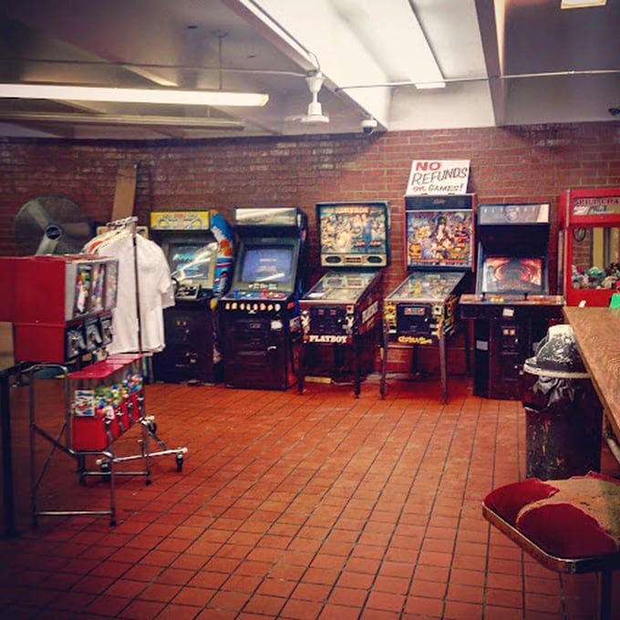 While waiting for showtime, these arcade classics offer a nostalgic warm-up act. That "No Refunds" sign? Consider yourself warned, pinball wizards.