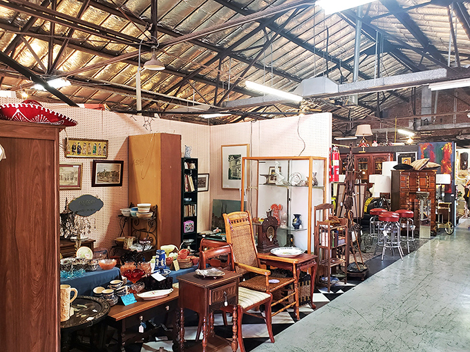Look up! The industrial ceiling reveals the building's past life, while below, carefully curated vignettes tell stories of bygone eras.
