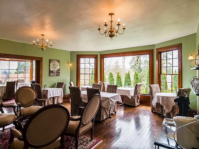 The emerald-walled dining room, where breakfast conversations flow as smoothly as the coffee and morning light spills across polished hardwood floors. 