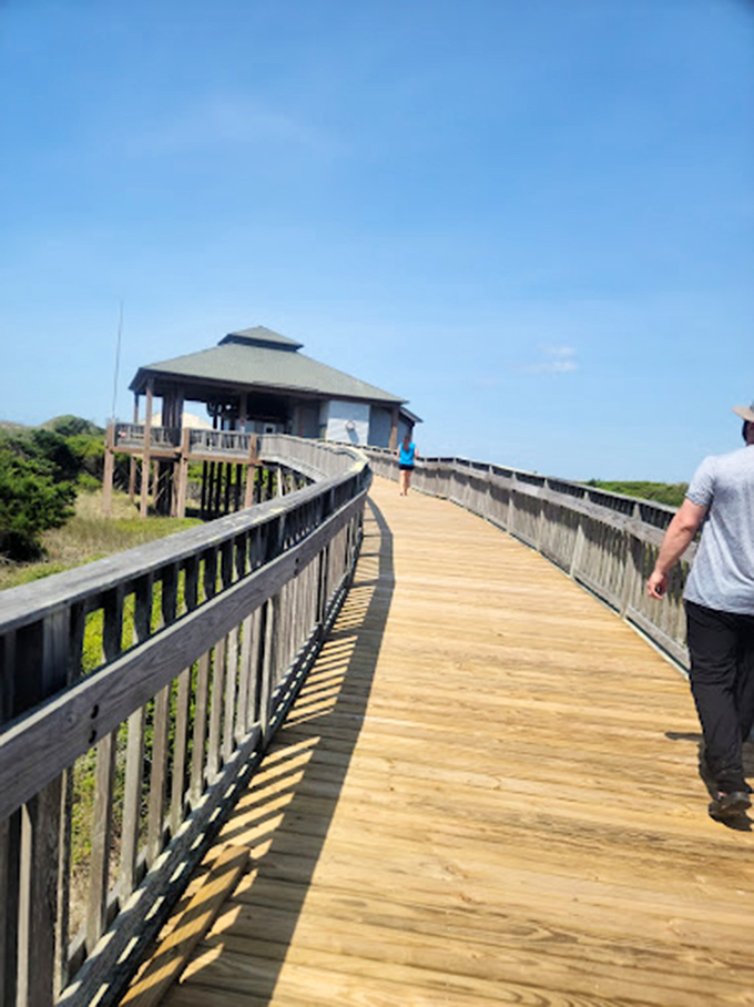 This boardwalk doesn't just lead to a building; it's the threshold between everyday life and coastal serenity.