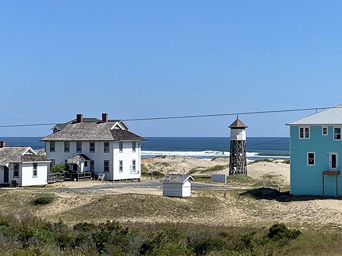 Historic buildings stand sentinel along the shoreline, remnants of a simpler time when "beachfront" meant actual beach.