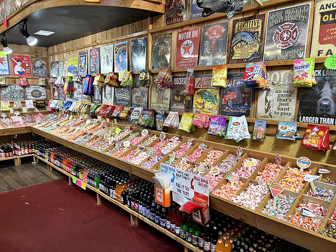 A candy archaeologist's dream dig: rows of colorful confections beneath vintage signs that tell America's story one sugary bite at a time.