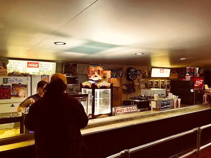 At this concession counter, nostalgia comes with butter-drenched popcorn and hot dogs that snap just right when you bite them.