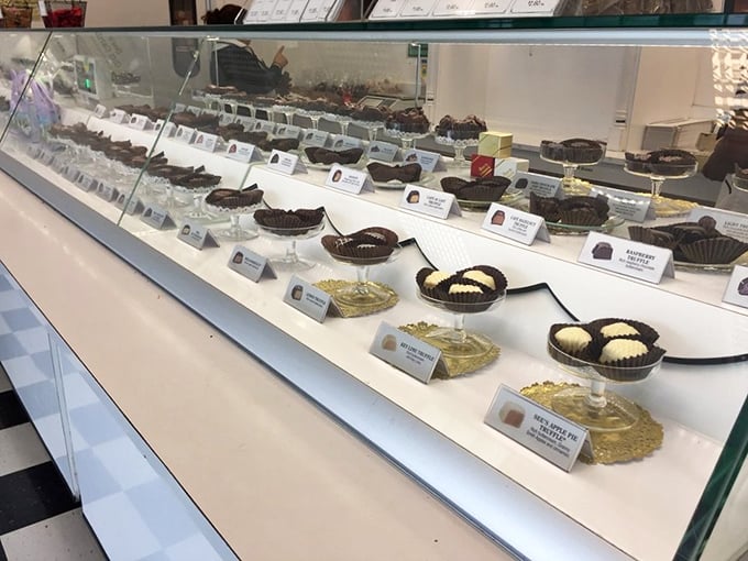 Chocolate paradise arranged with military precision. Each piece waits patiently in its paper cup, like actors ready for their delicious curtain call.