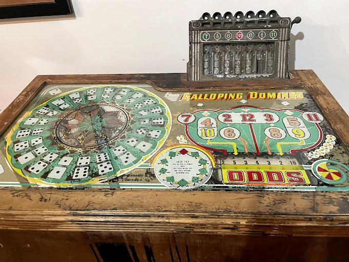 "Galloping Dominoes" wasn't your grandmother's parlor game. This vintage gambling contraption separated many a sucker from their hard-earned cash.