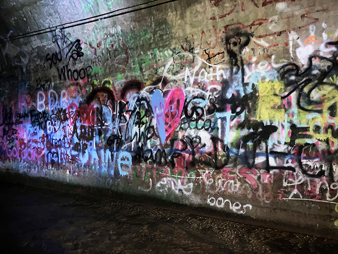 Every inch tells a story &ndash; the tunnel walls serve as an ever-changing canvas where generations of visitors leave their mark alongside decades of local lore.