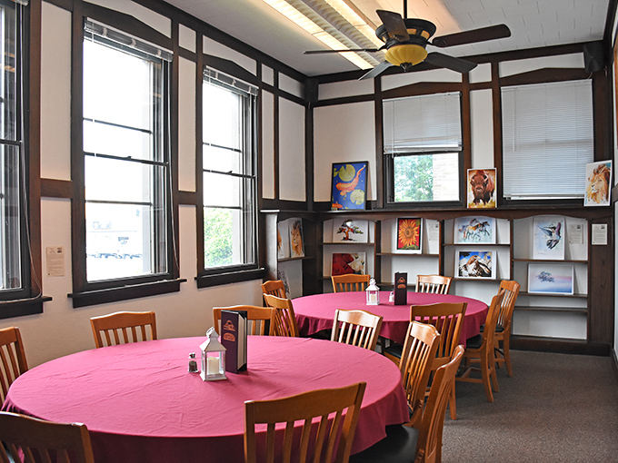 Pink tablecloths and wooden chairs create the perfect setting for both serious conversations and serious eating. The art on the walls is just the appetizer.
