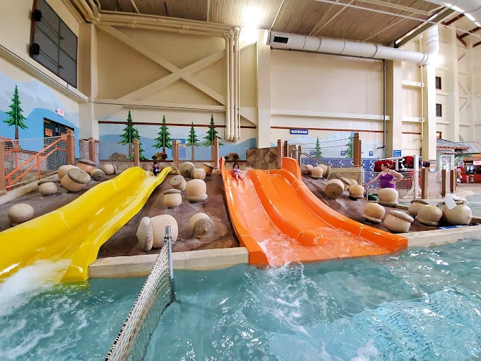 These twin slides prove Newton's lesser-known law: what goes down a colorful tube at high velocity generates equal amounts of screaming and giggling.