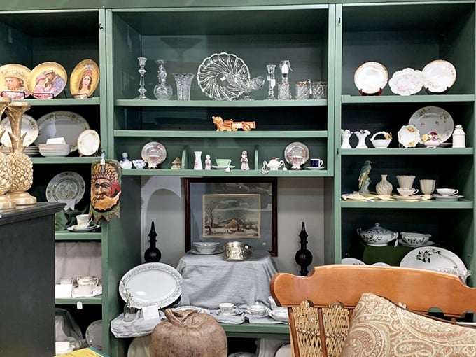 Grandma's china cabinet meets museum display. These shelves hold more family dinner memories than a Thanksgiving photo album.