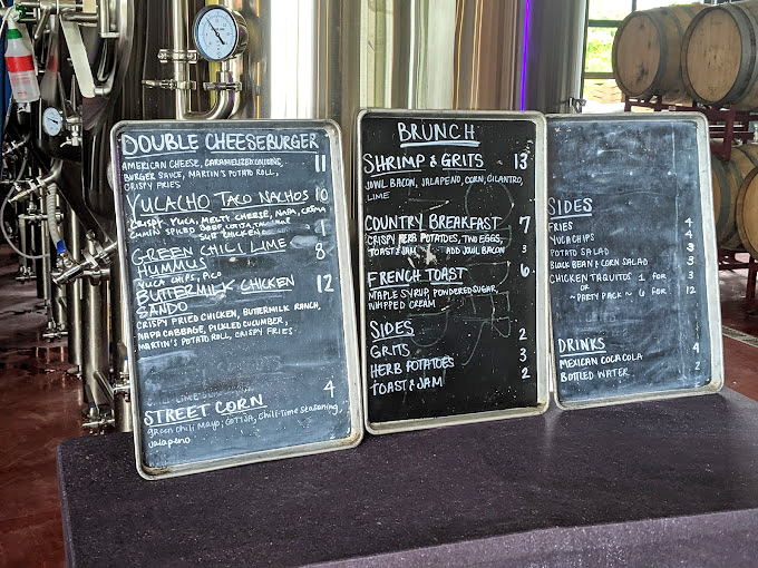 A chalkboard menu that speaks my language: comfort food classics with creative twists. Decision paralysis has never been so delicious.